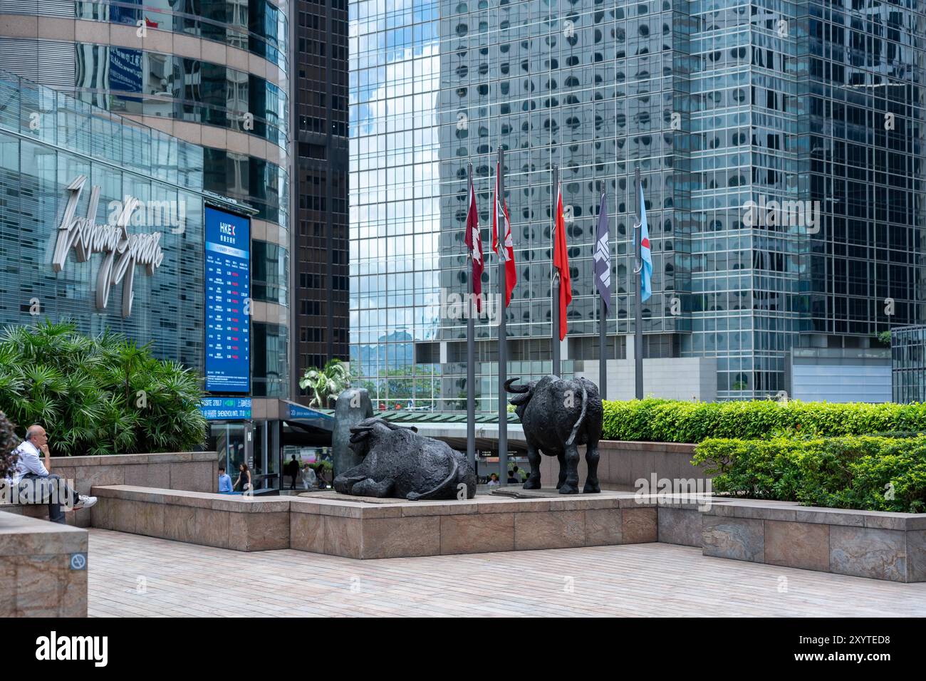 Hong Kong, China - July 03, 2024 : Two black bull statues stand in a ...
