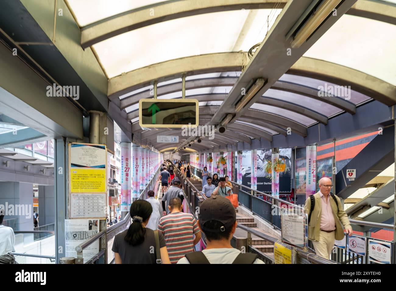 Hong Kong, China - July 03, 2024 : A covered walkway in Hong Kong with ...