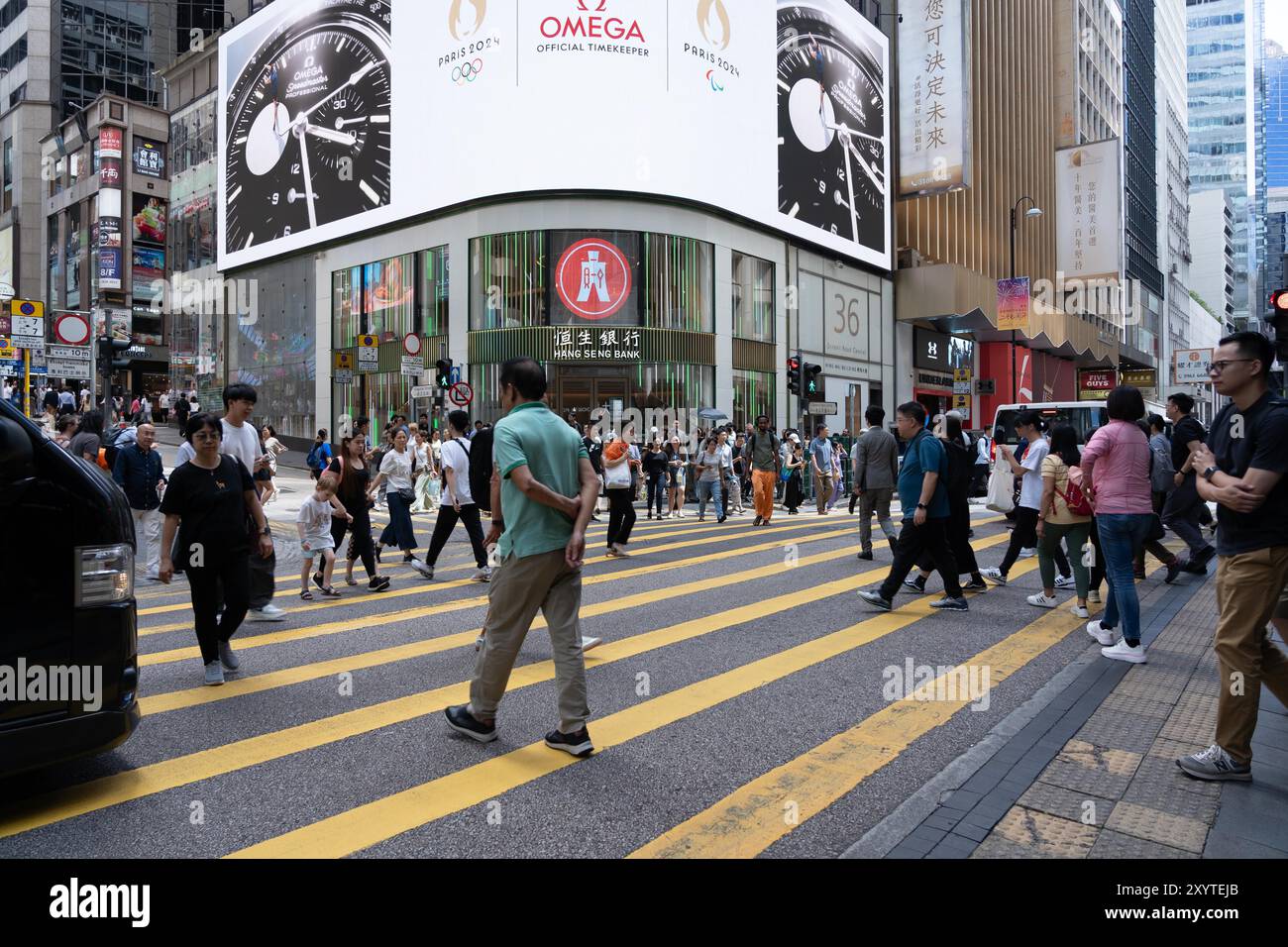 Hong Kong, China - July 03, 2024 : A busy crosswalk in a bustling Hong ...