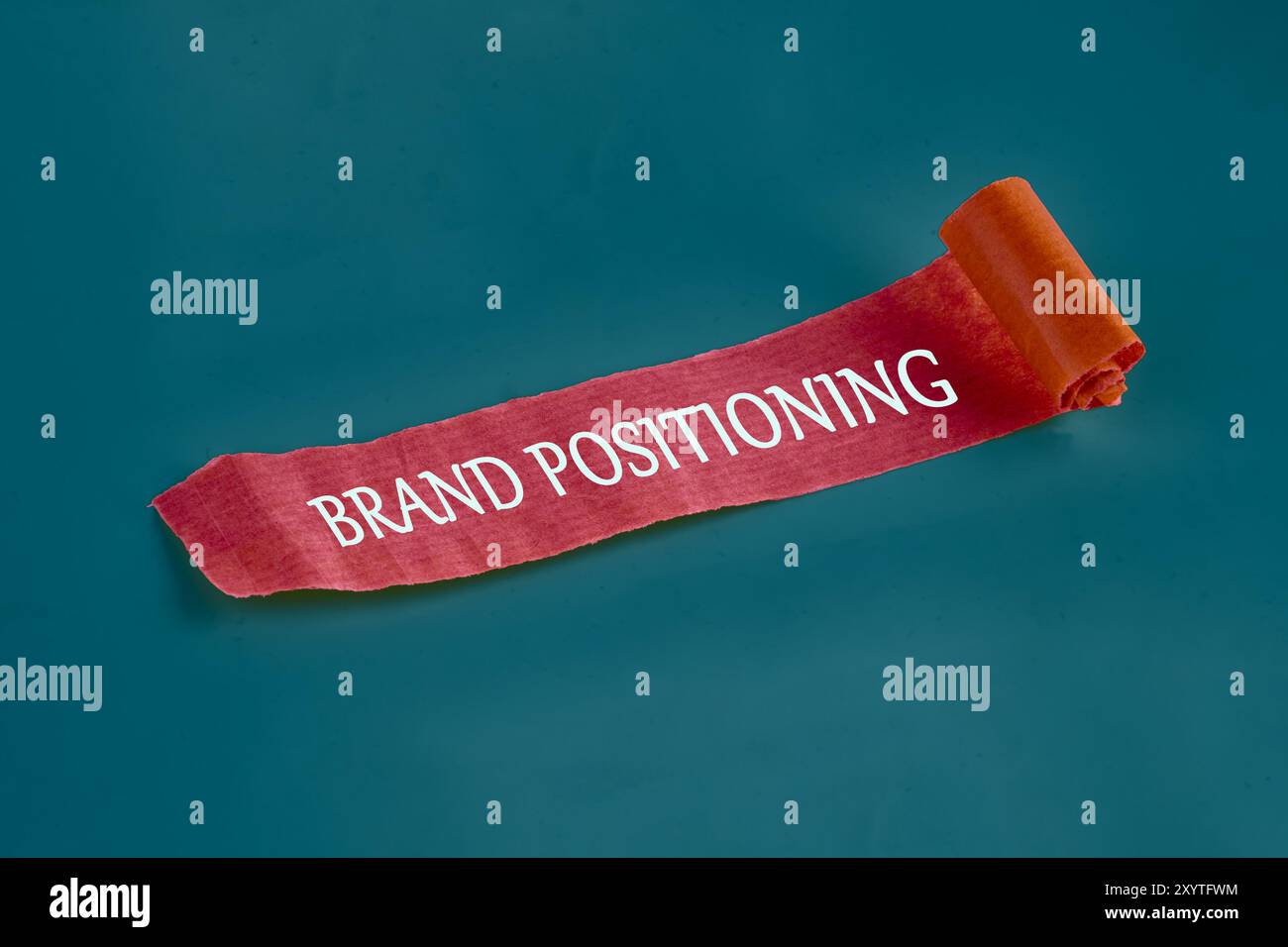 Economic concept. The inscription BRAND POSITIONING on an unfolded ...