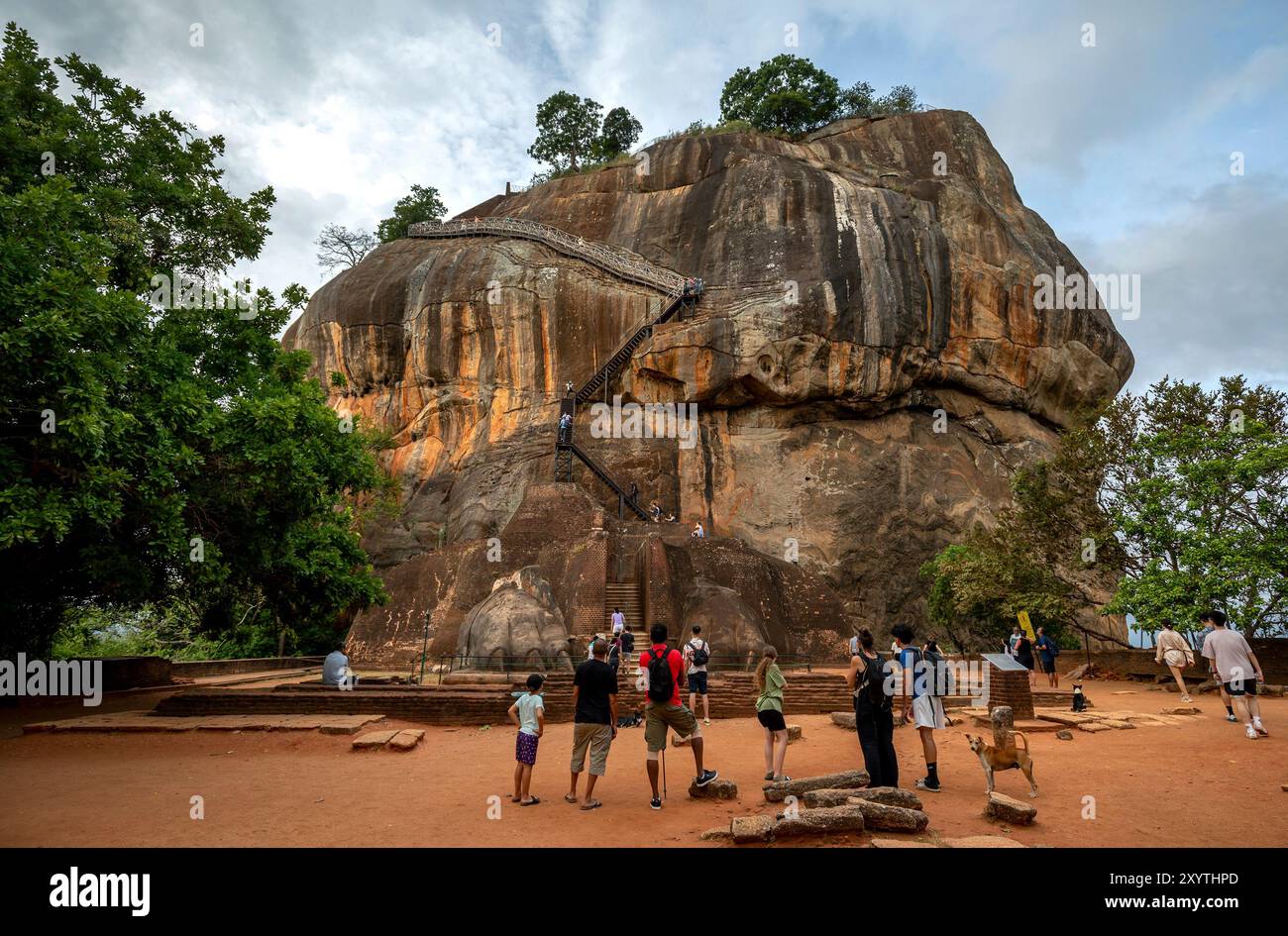 Tourists admire the Lions Paws on the Lions Platform at Sigiriya Rock ...
