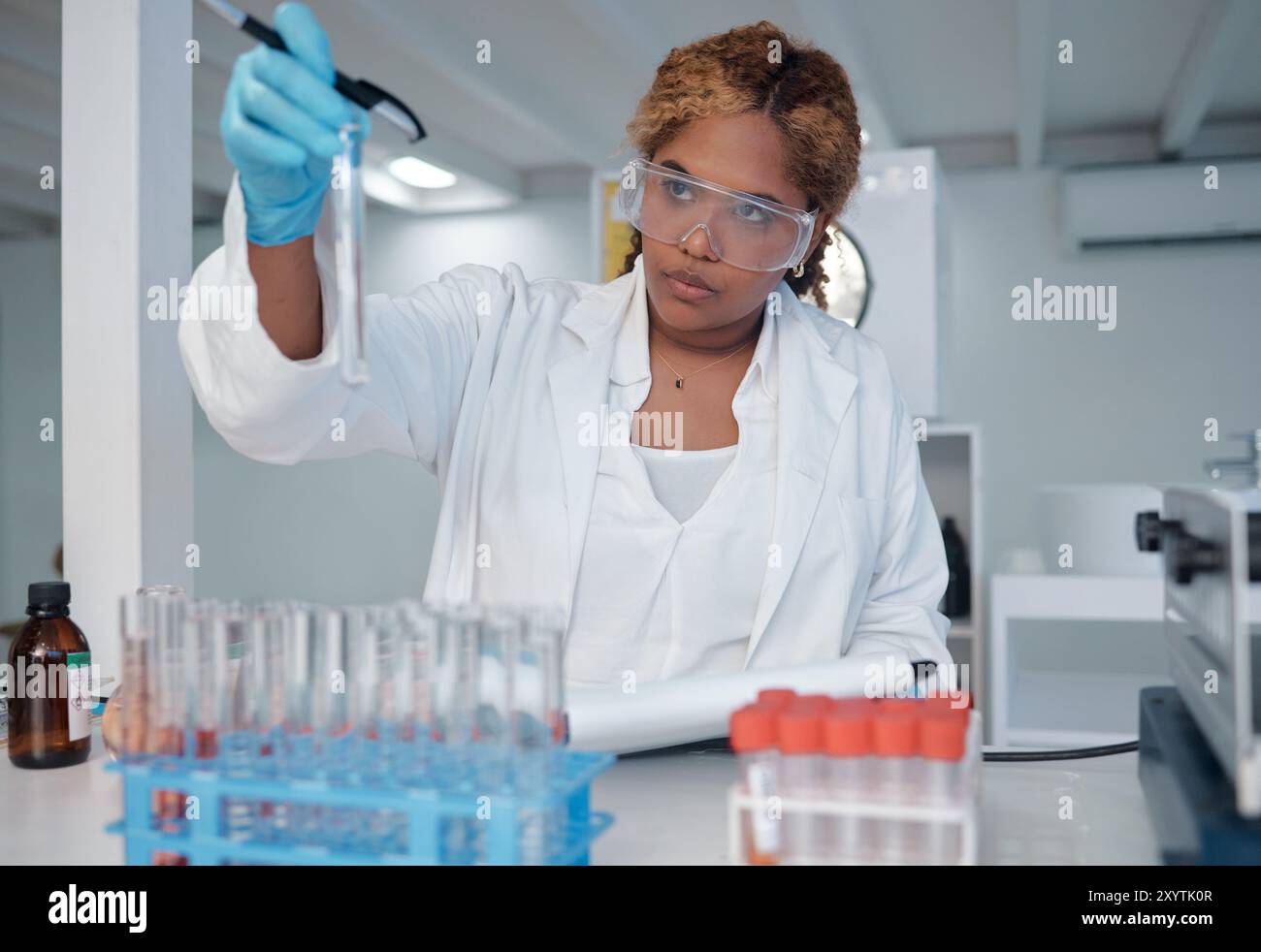 Scientist, test tube and science in lab for innovation, biotechnology ...