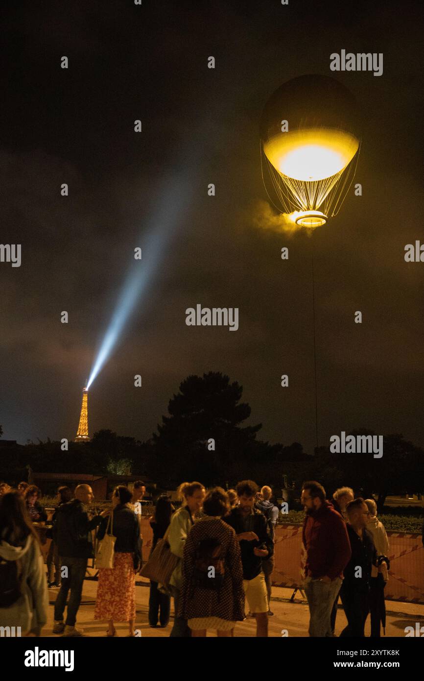 The Paralympic cauldron is floating above the gardens of Tuileries ...