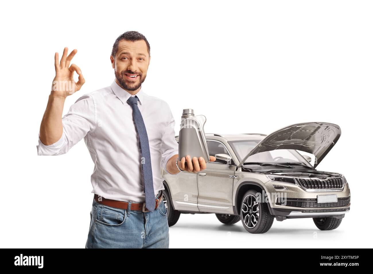 Driver holding an engine oil plastic bottle and gesturing ok sign ...