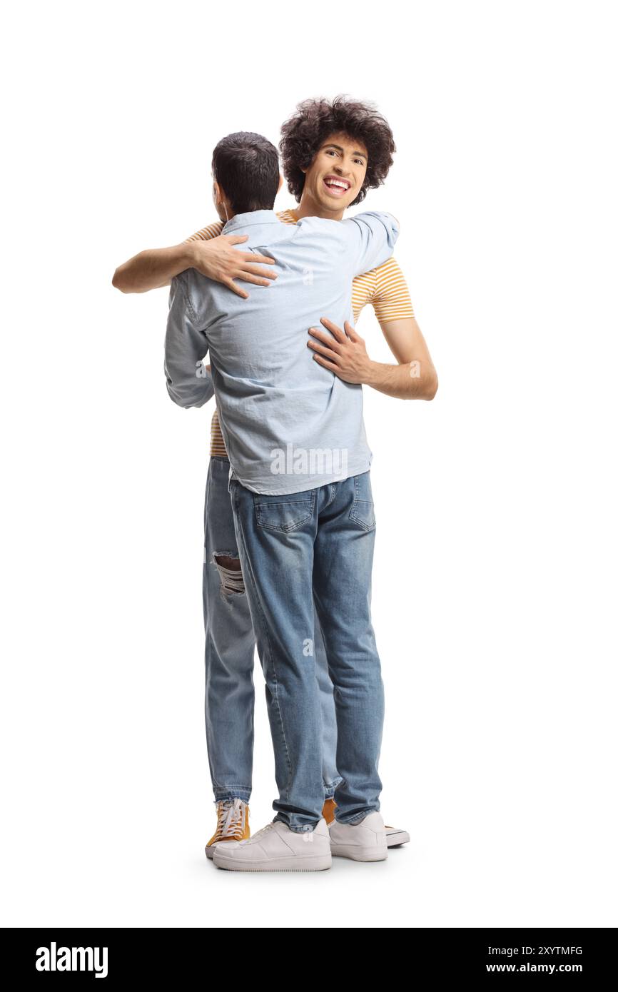 Full length shot of young men hugging each other isolated on white ...