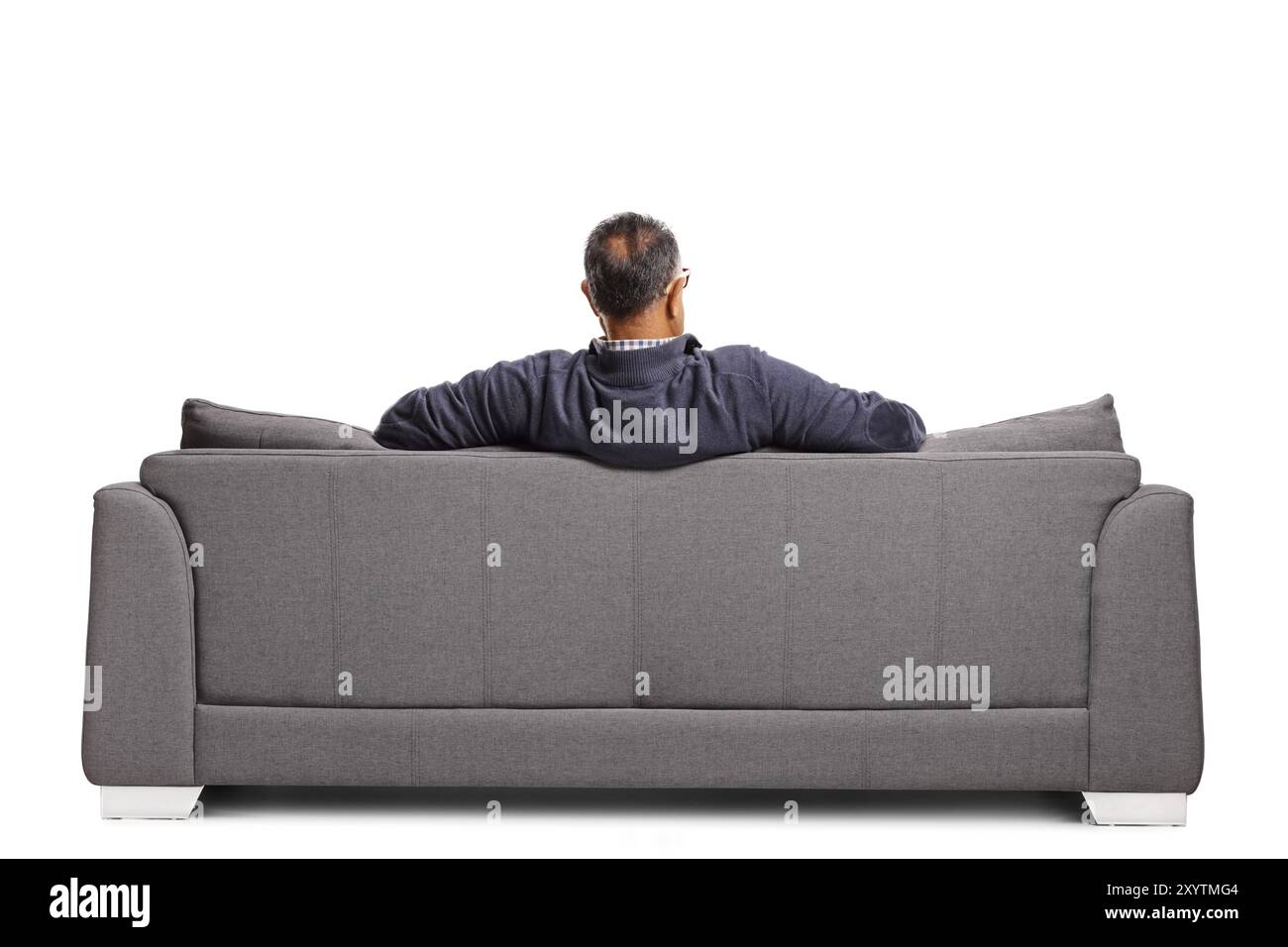 Man sitting sofa rear Cut Out Stock Images & Pictures - Alamy