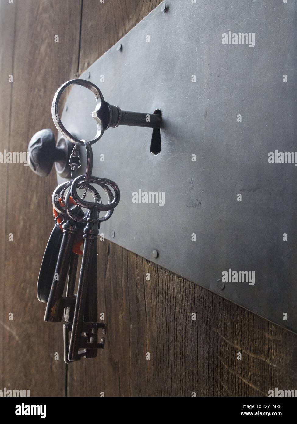 Old keys in a door lock Stock Photo - Alamy