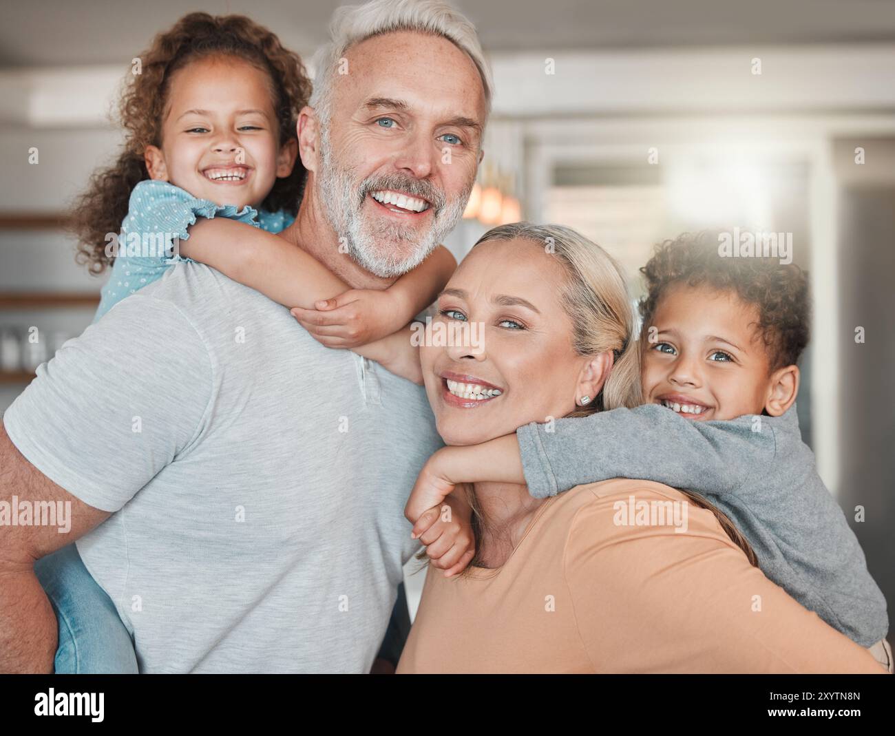Happy, portrait and grandparents with children for piggyback in home ...