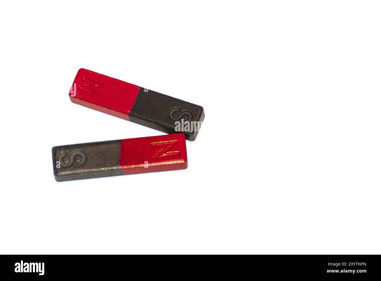 Two magnets isolated on white Stock Photo - Alamy