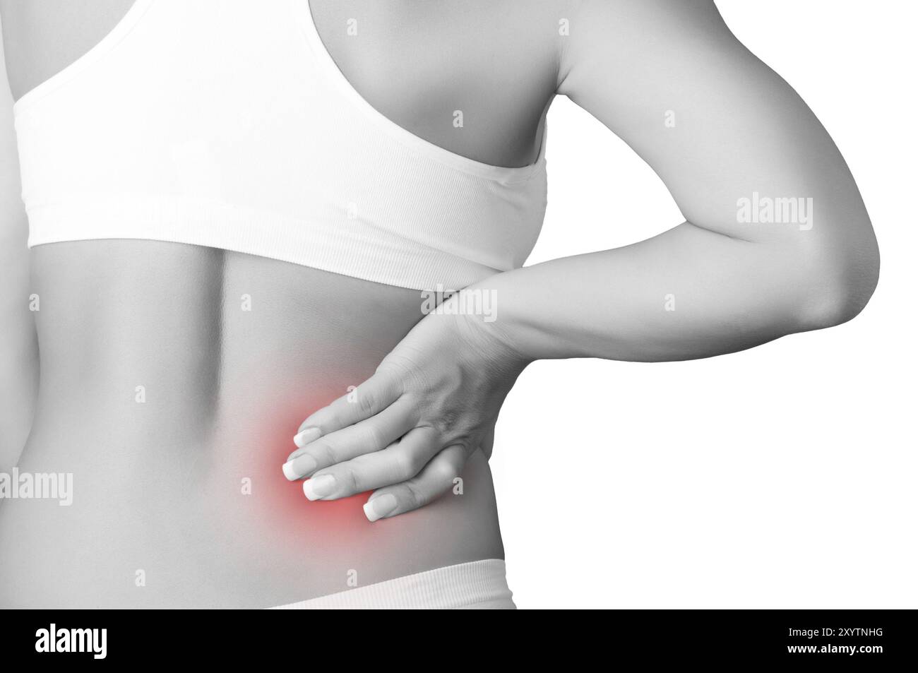 Young woman with pain in her lower back. Red circle around the painful ...