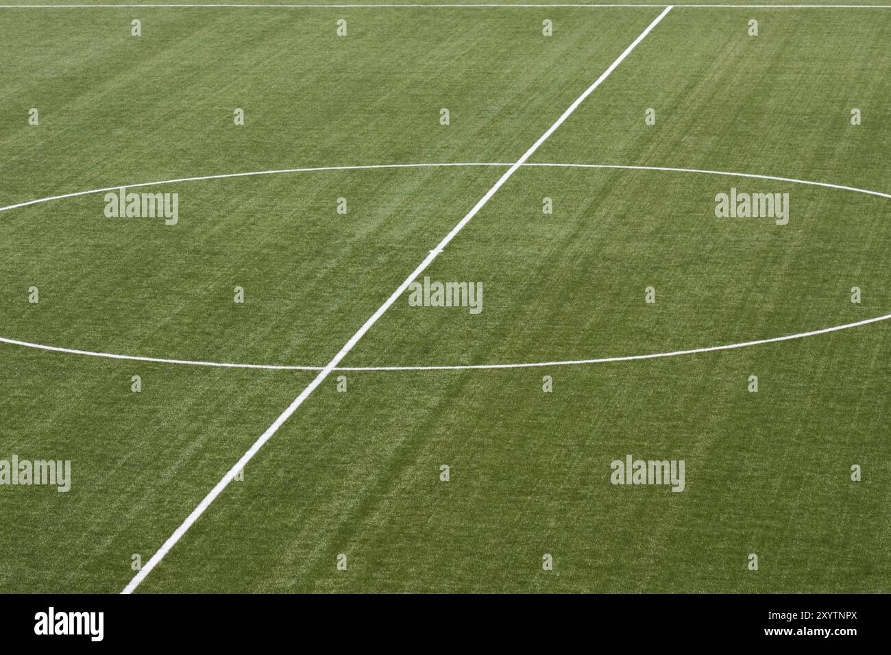 Playing soccer sport green grass field background Stock Photo - Alamy