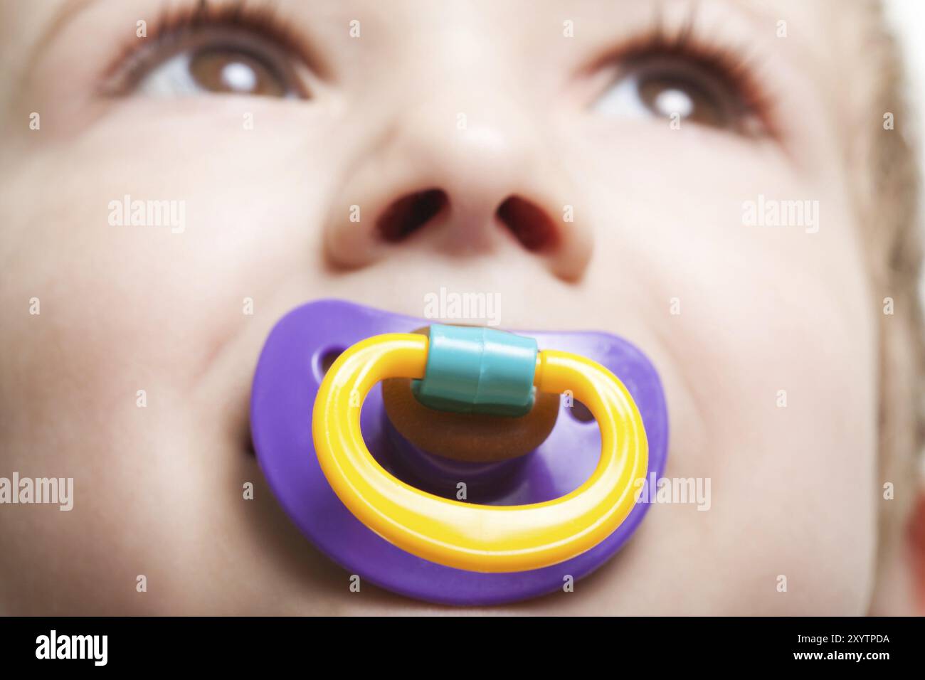Little child boy and plastic baby soother pacifier Stock Photo - Alamy