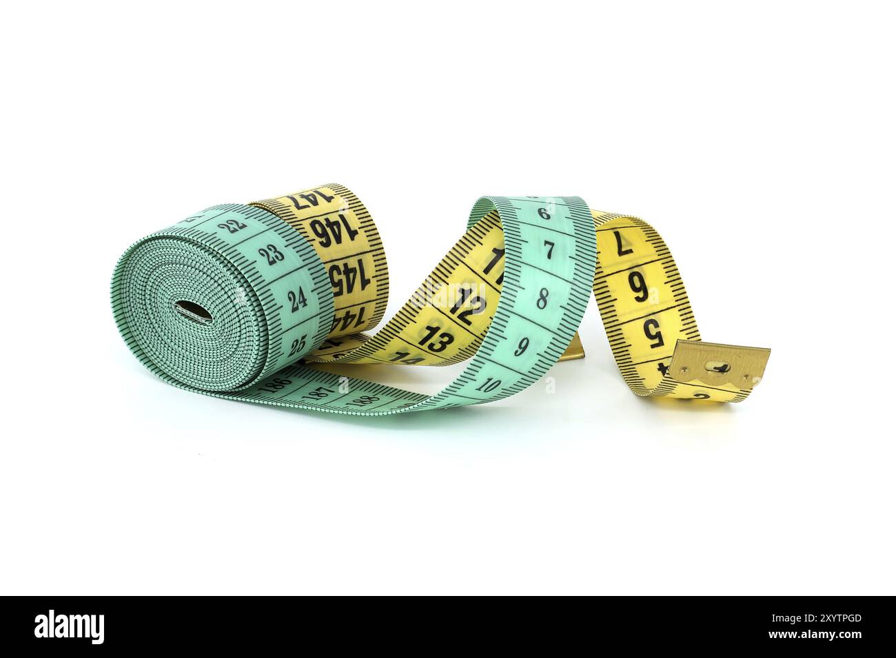 Spirals of green and yellow tape measure create a visual impression of ...