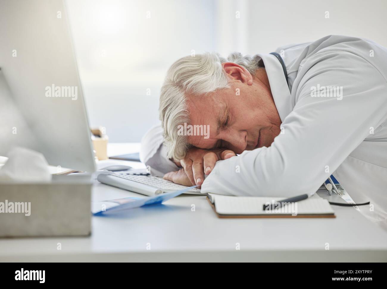 Tired doctor sleeping medical workplace hi-res stock photography and ...