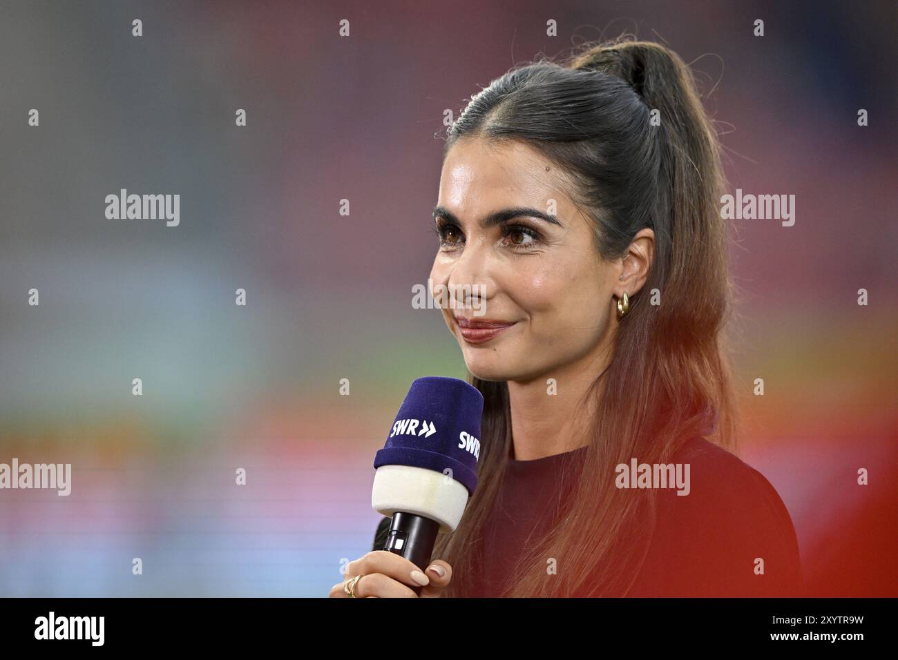 TV presenter Lea Wagner in an interview, microphone, logo, SWR ...