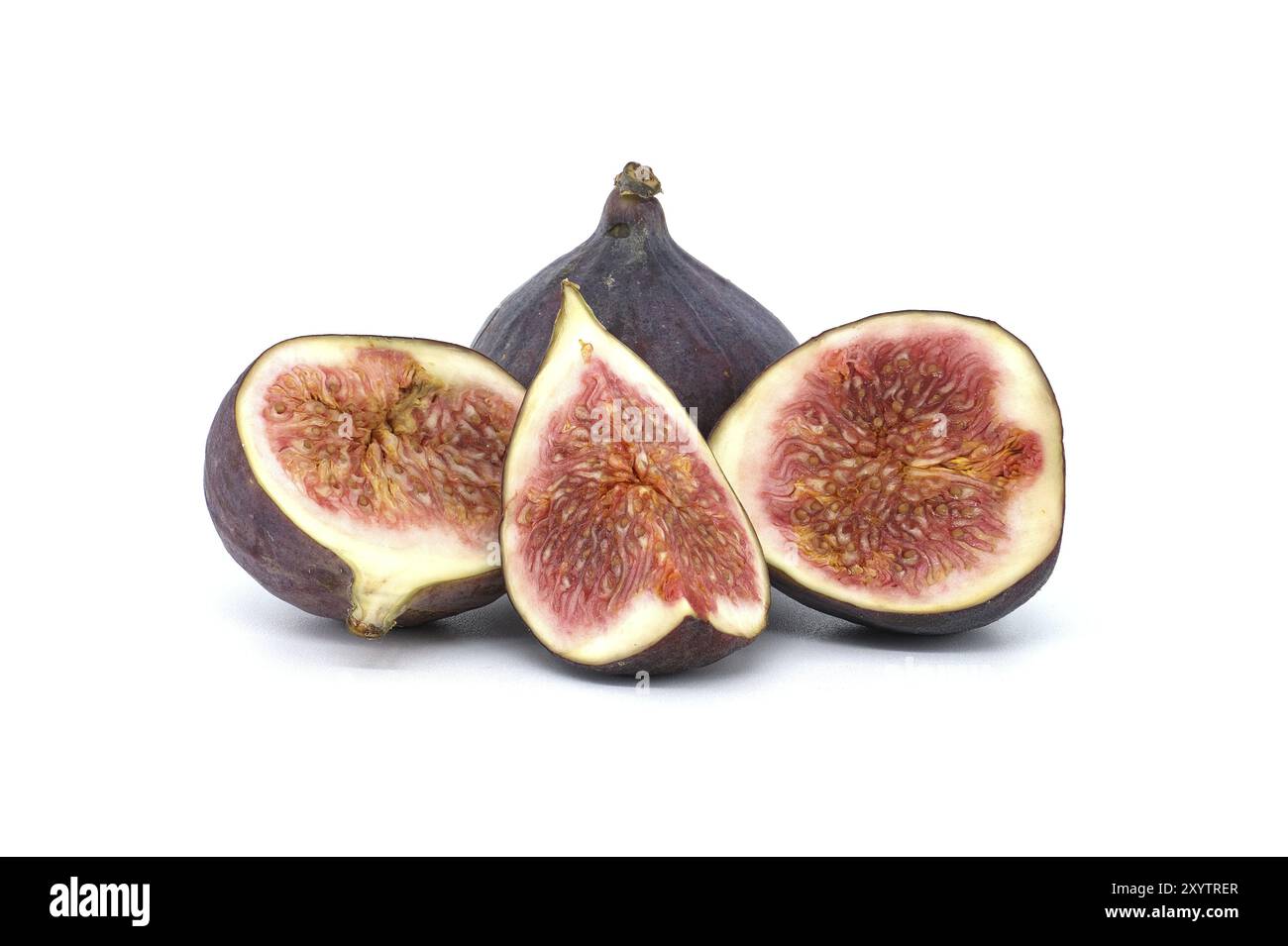 Fresh figs whole and sliced in half isolated over white background ...