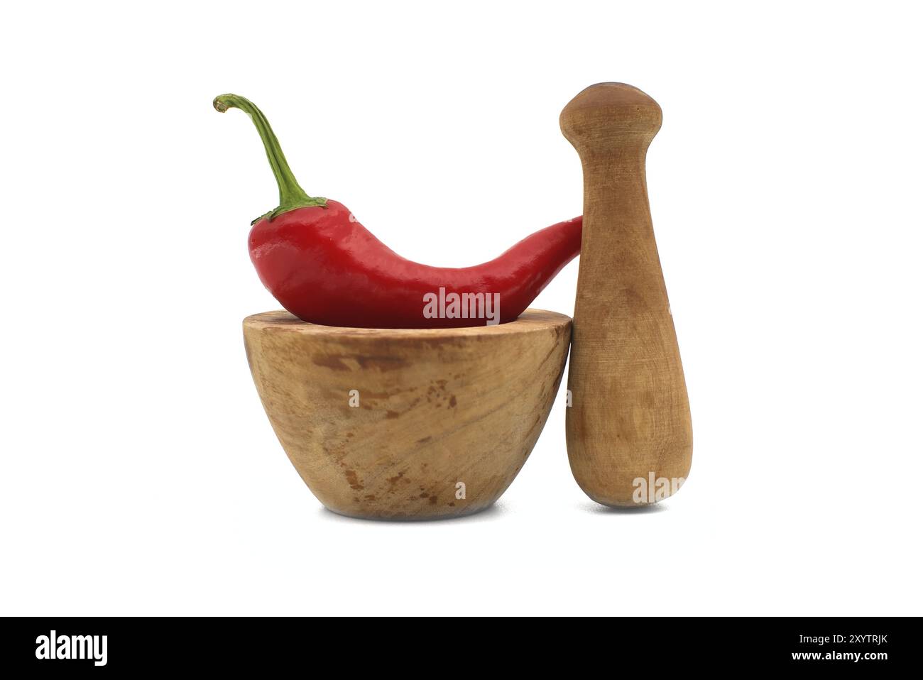 Fresh red chili pepper and old rustic wooden pestle with mortar ...