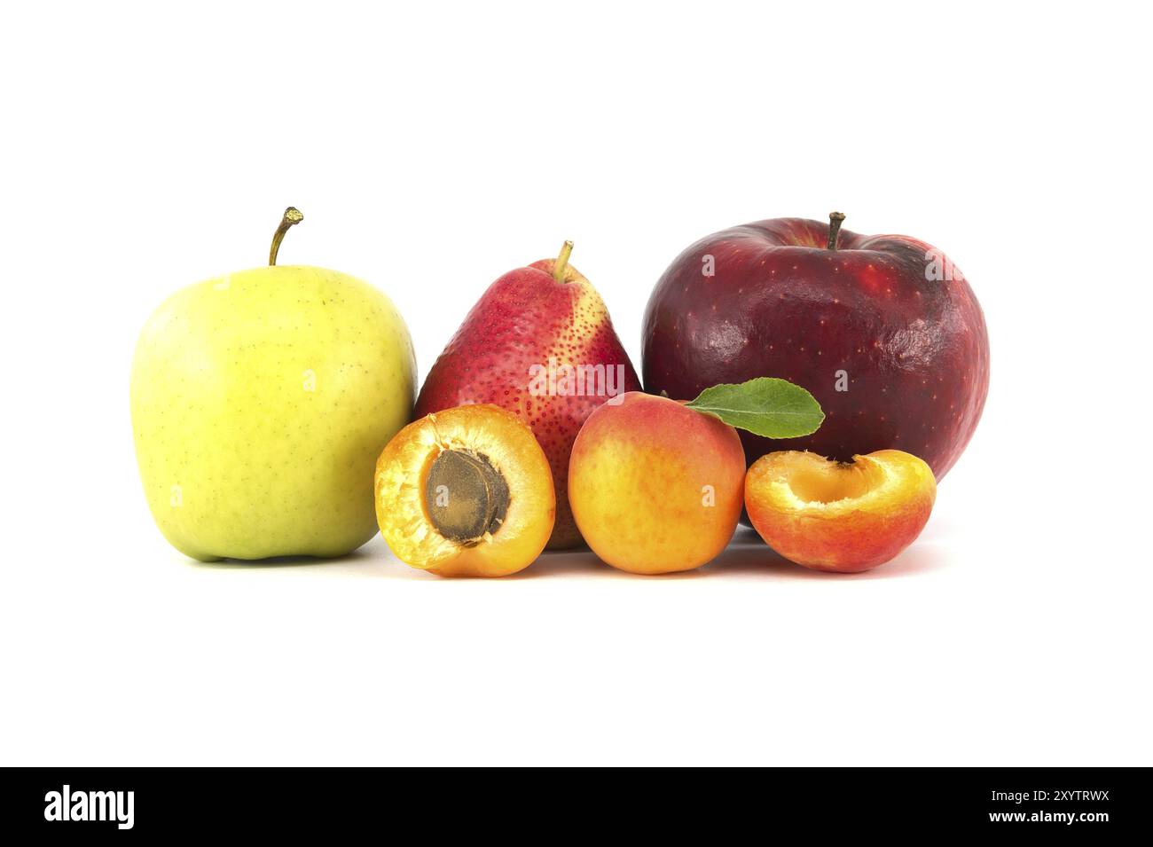 Whole and halved ripe apricots, multicolored pear, red and green apples ...