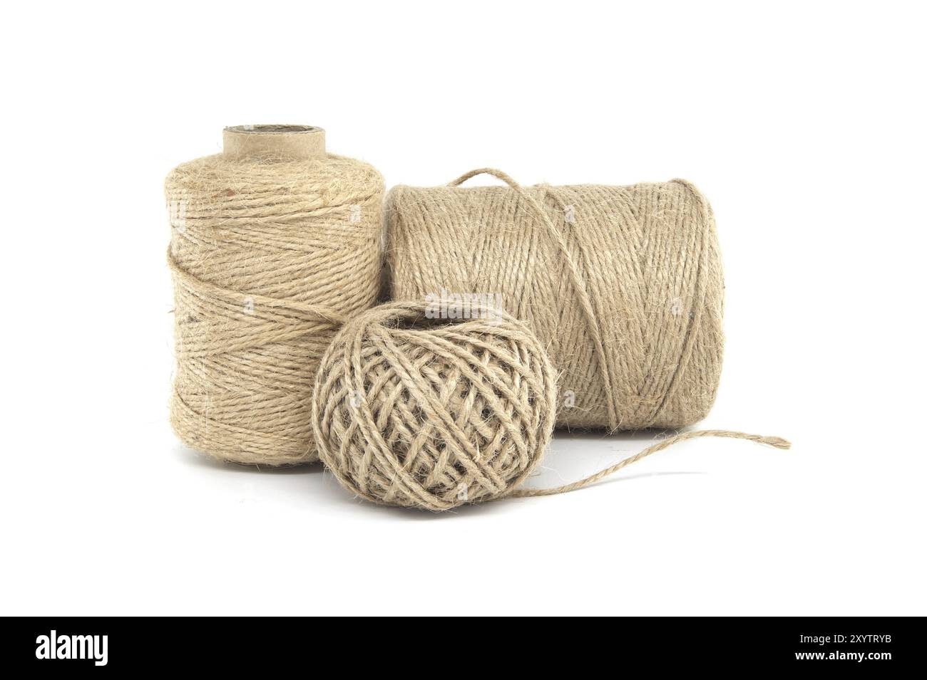 Three spools of jute twine isolated on white background, each varying ...