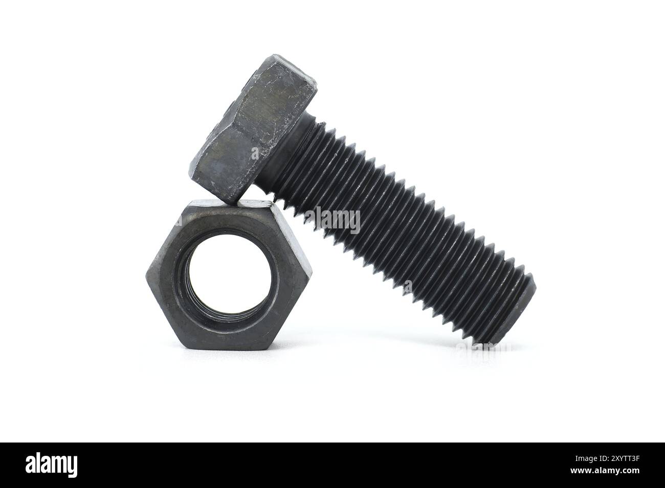 Black metal hexagonal bolt and nut shown in close-up isolated on white ...