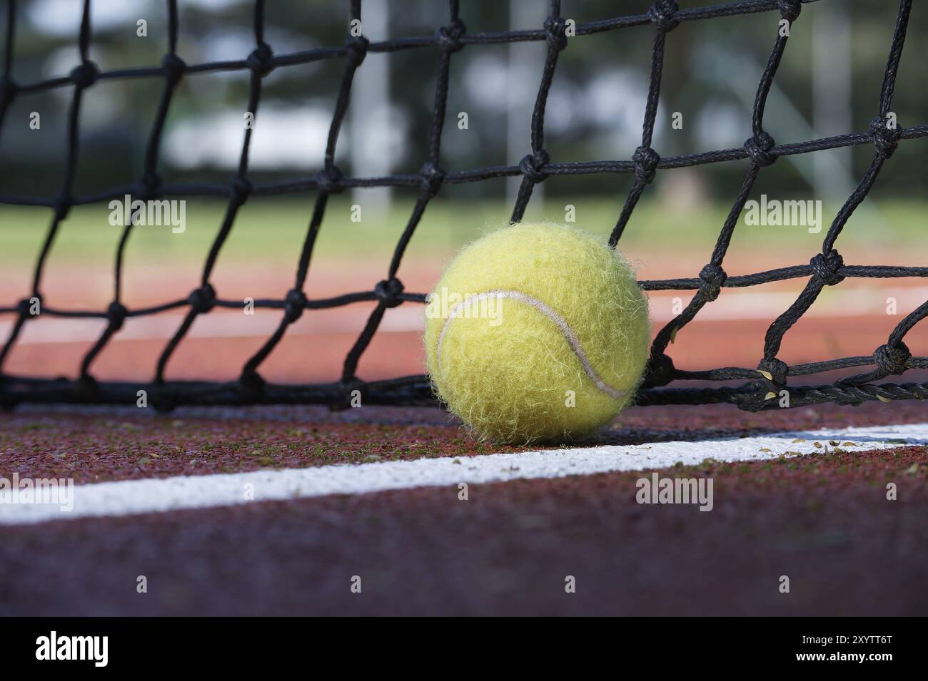 Tennis ball in the net. Ball hitting the tennis net, tennis scene with ...