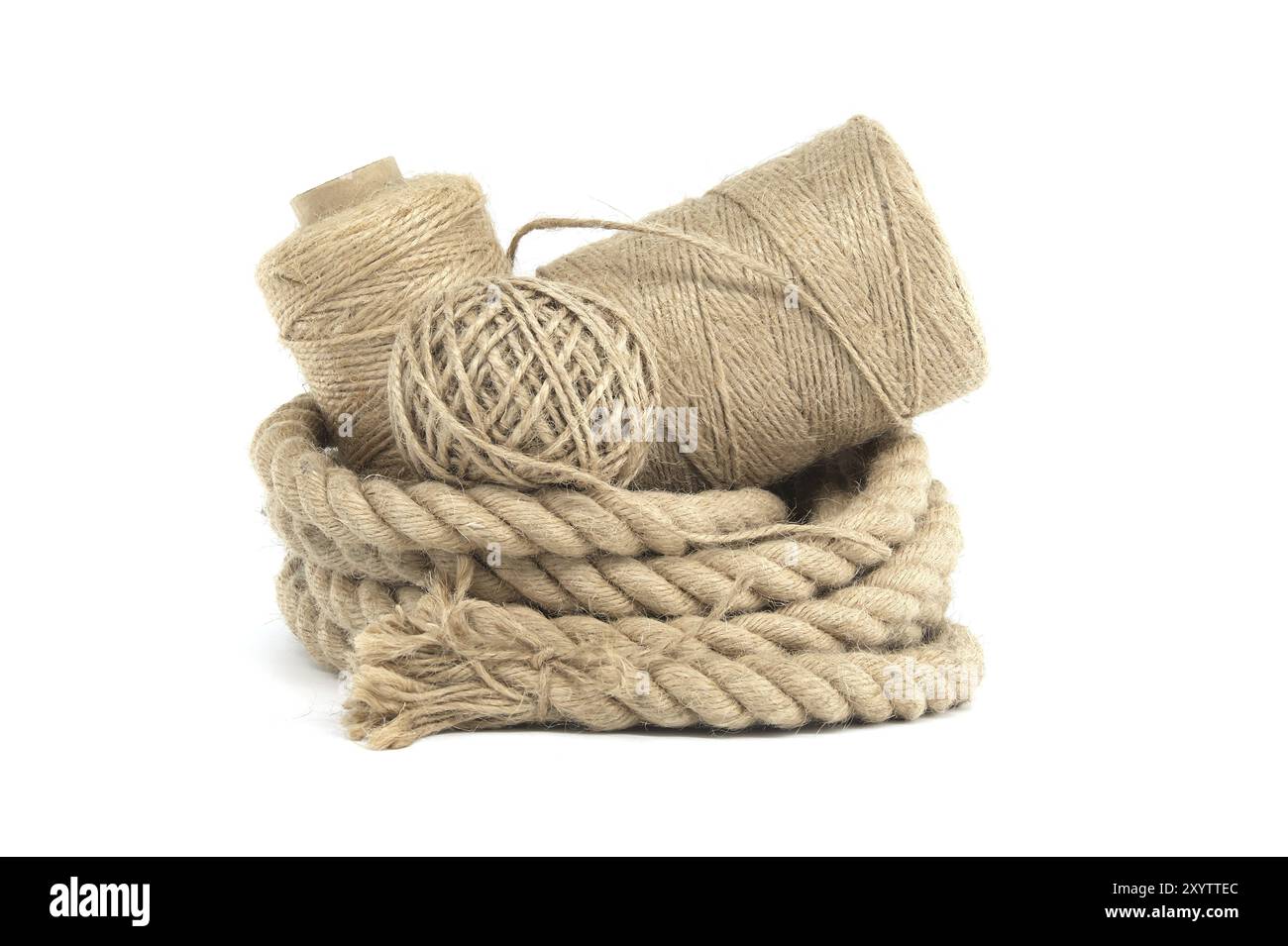 Collection of various rolls of natural jute rough rope and twine ...
