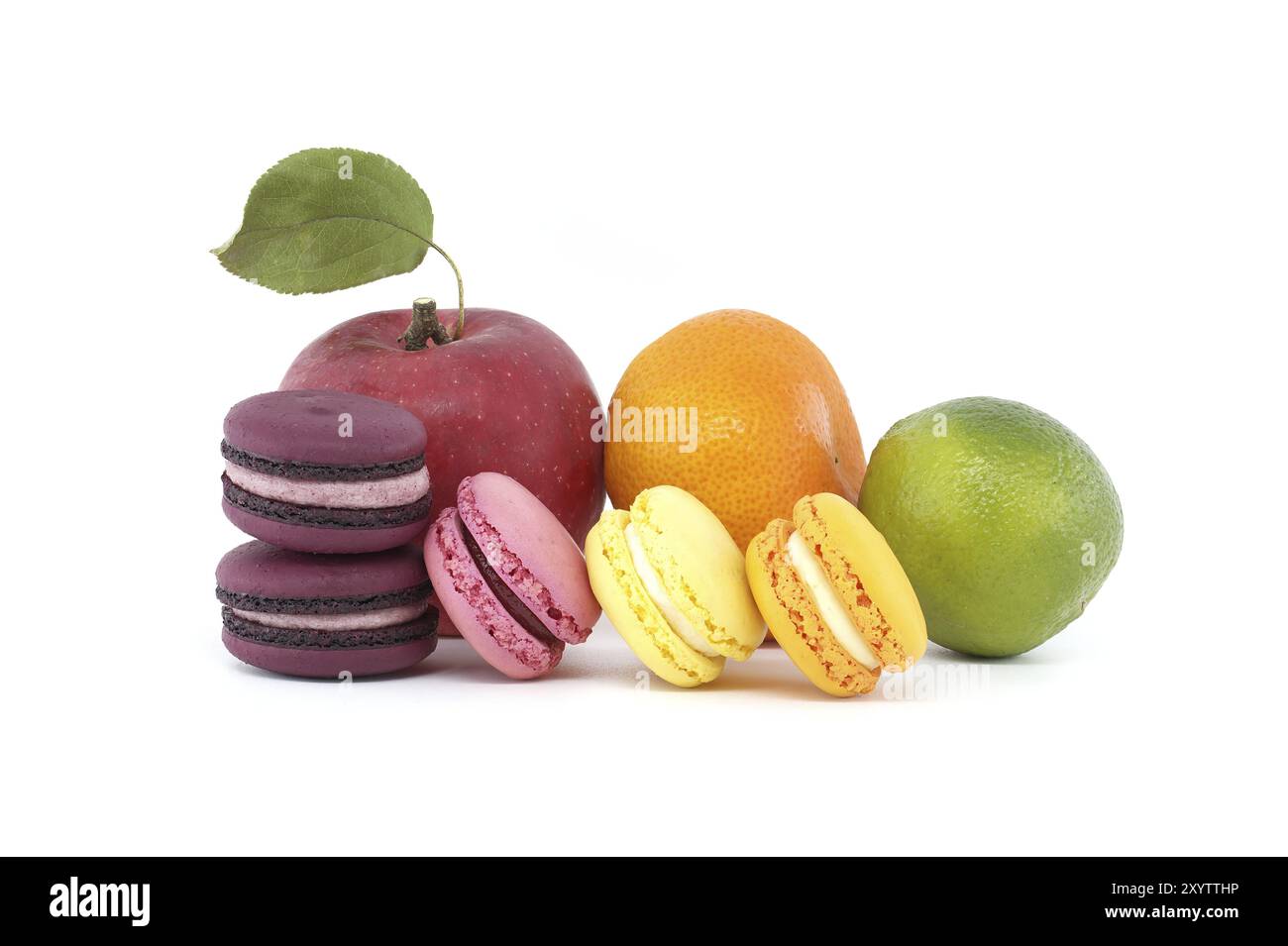 Vibrant assortment of macaroons and fruits isolated on white background ...