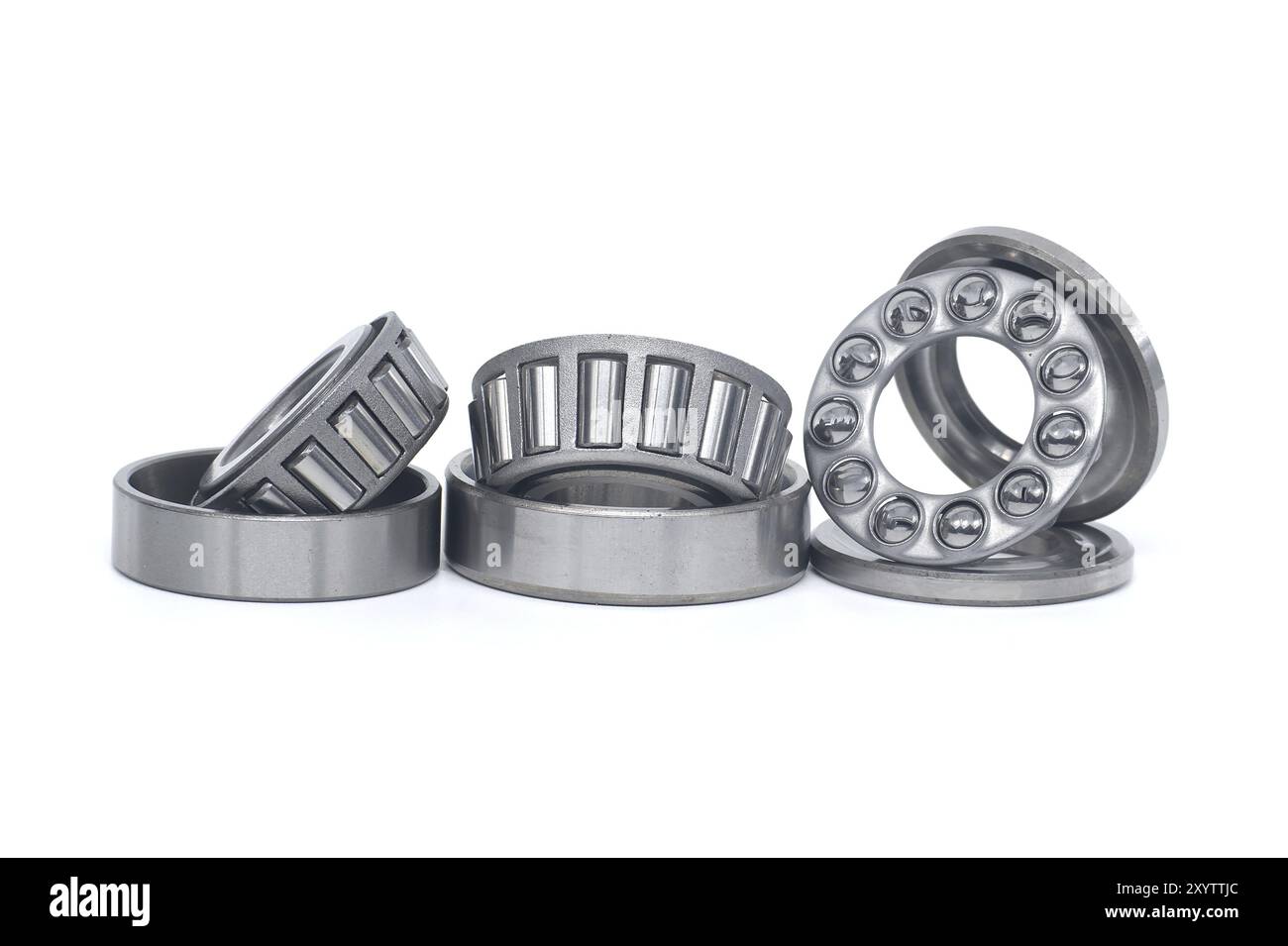 Single row tapered roller bearings and thrust ball bearings isolated on ...