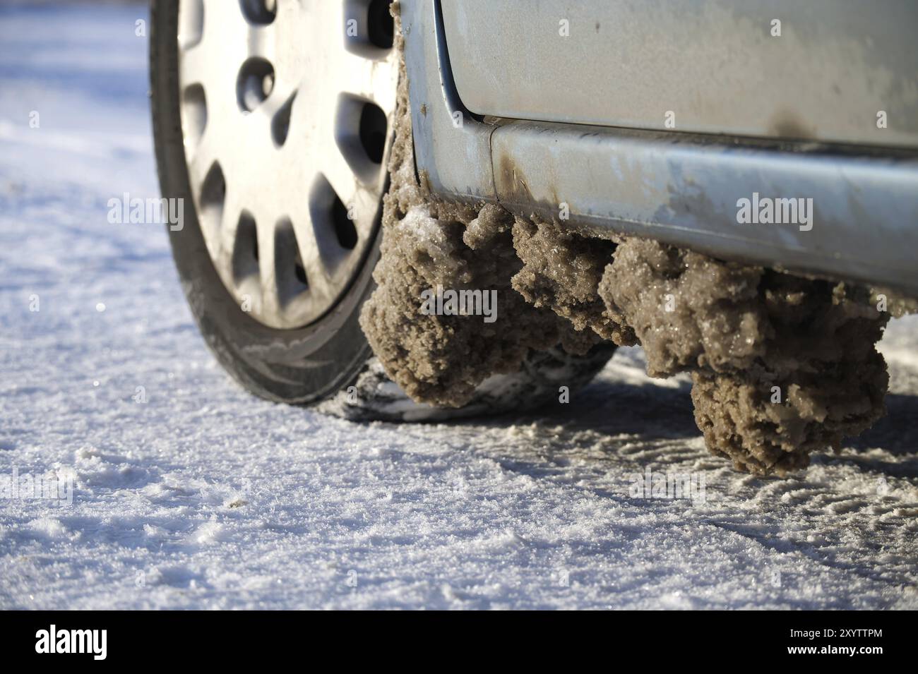Frozen slush on the bottom of the car, vehicle has been driven on ...