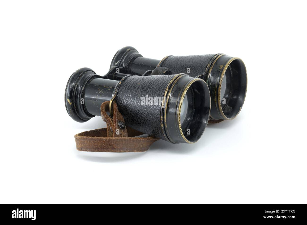A pair of antique black binoculars with brown leather straps is ...