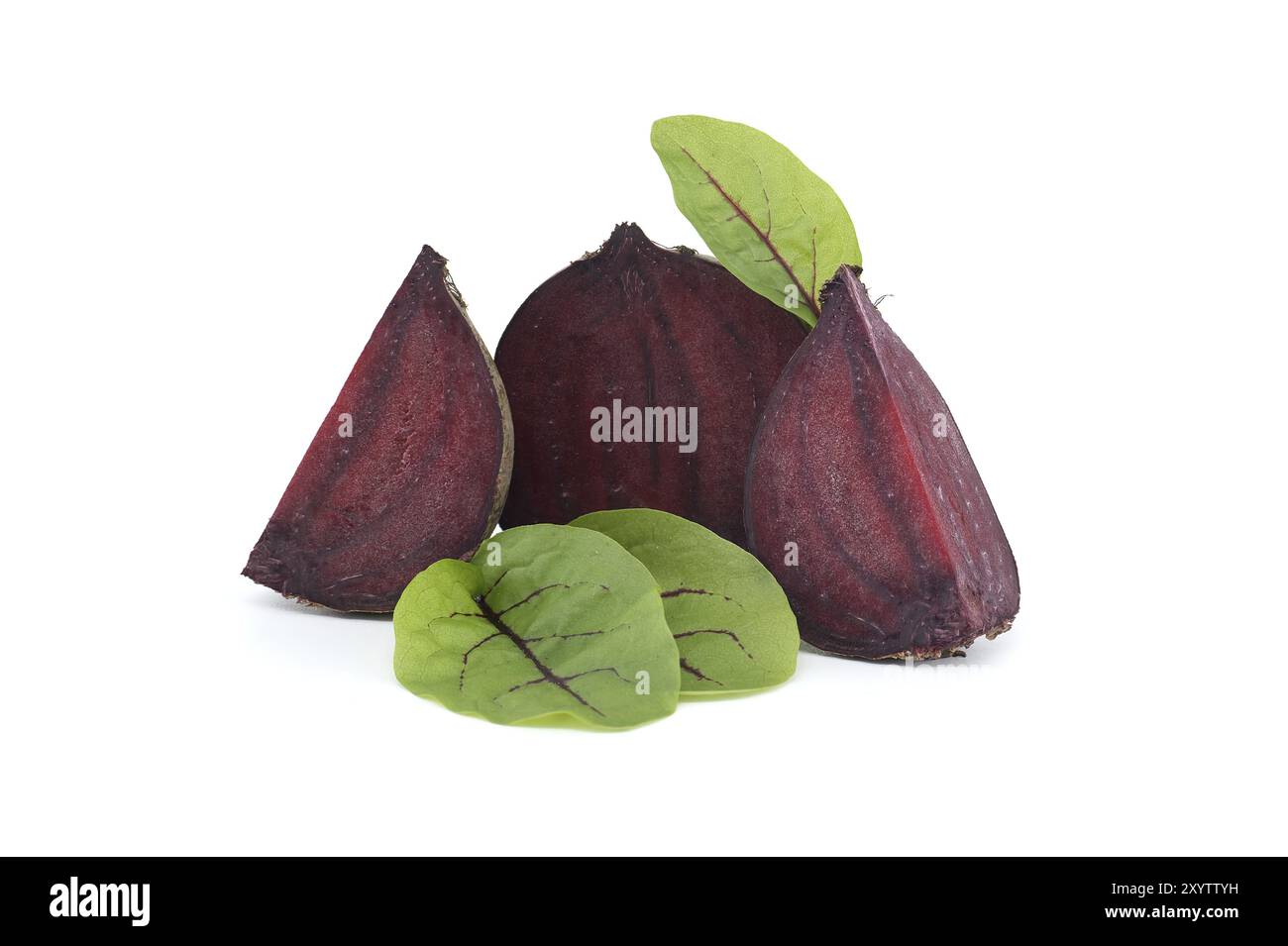 Slices of beetroot revealing their vibrant purple interiors complete with their fresh green ...