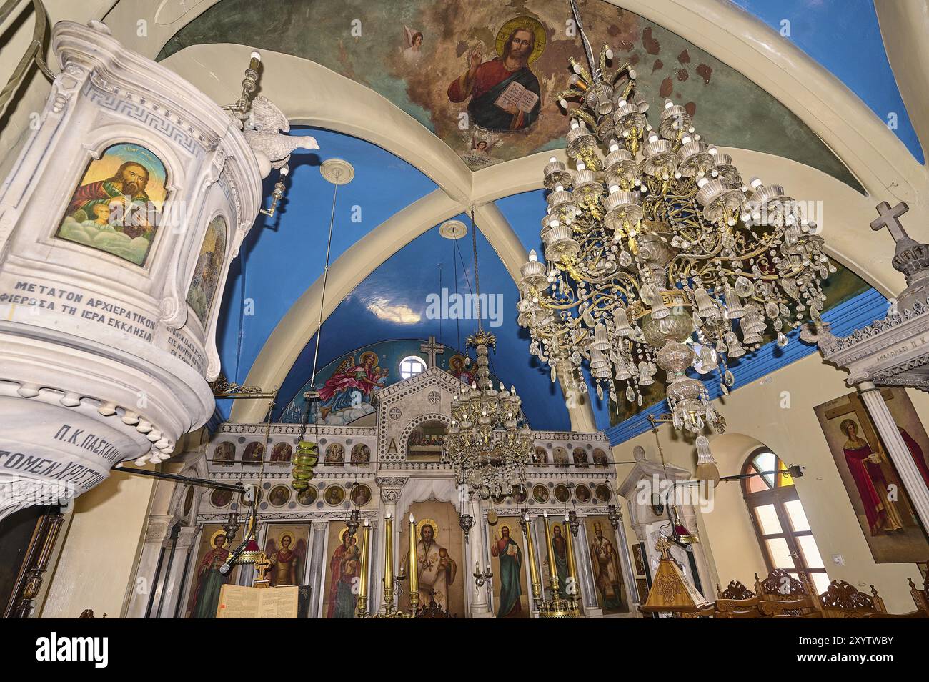 Magnificent church interior with chandelier, images of saints and ...
