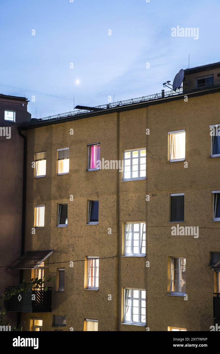 Modern apartment block at dusk, urban city life Stock Photo - Alamy