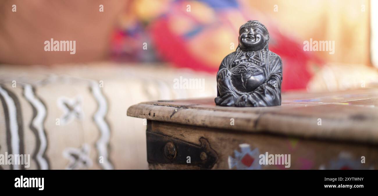 Feng shui: Buddha statue at on a table in the own living room Stock ...