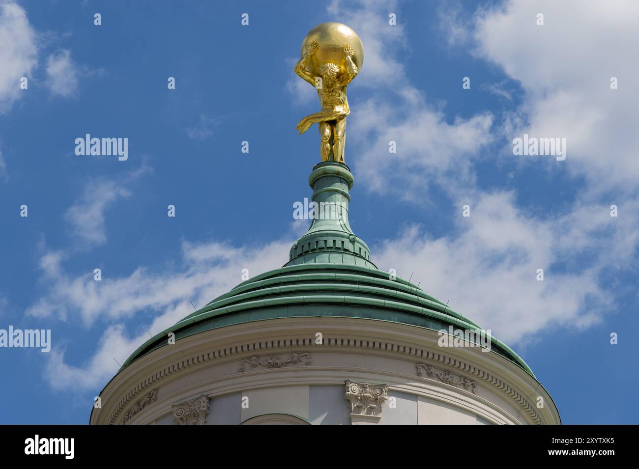 The sculpture of the Atlas on the spire of the Old Town Hall. Germany ...