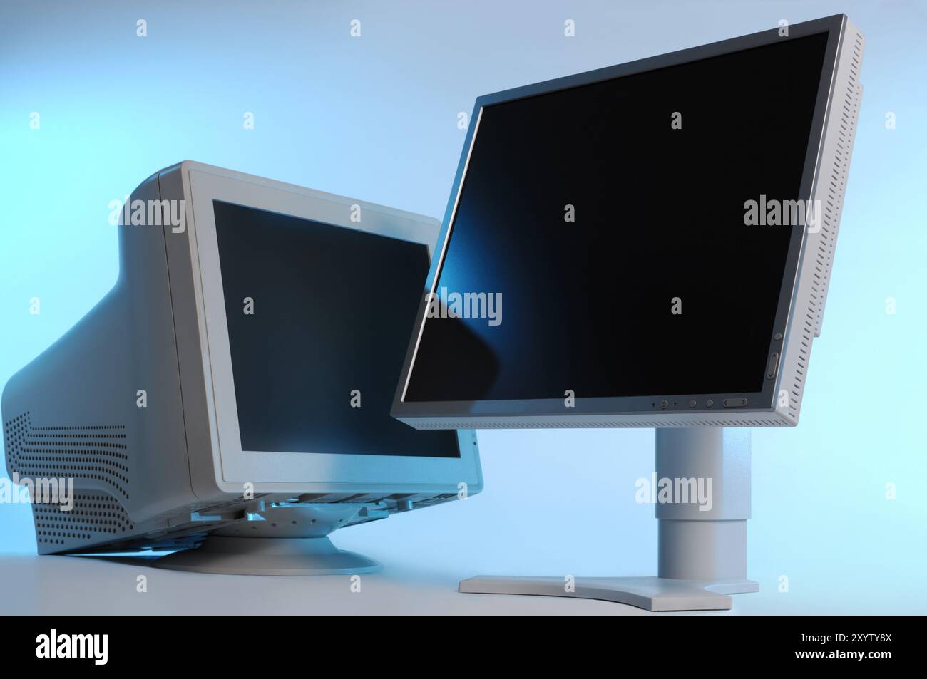 Old CRT monitor looking up at a brand new modern LCD display Technology ...