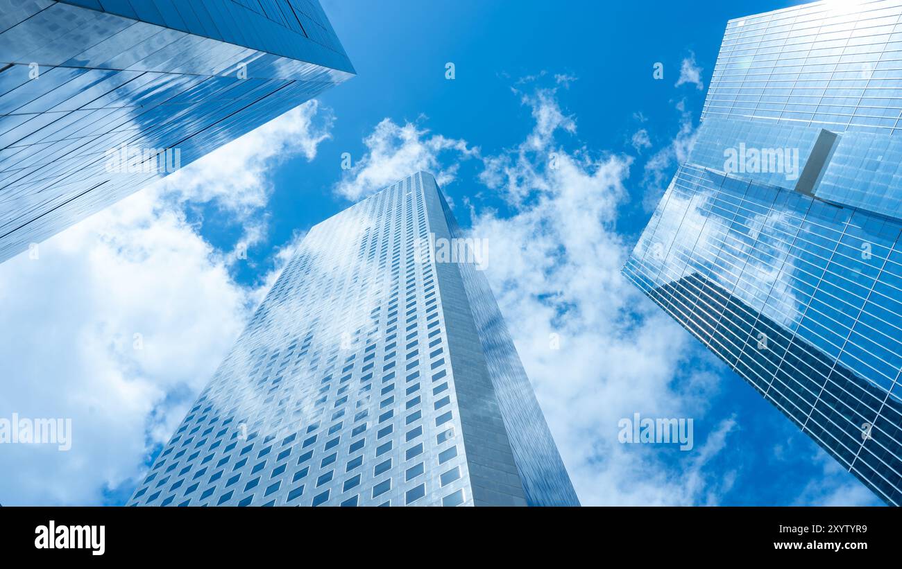 Looking Up modern high-rise office buildings with blue sky in the ...