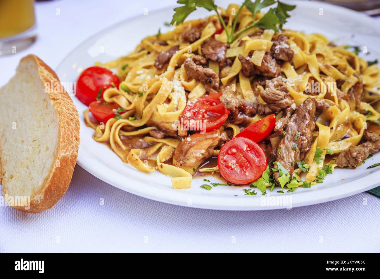 Dinner at Italy: Mediterranean pasta with beef Stock Photo - Alamy