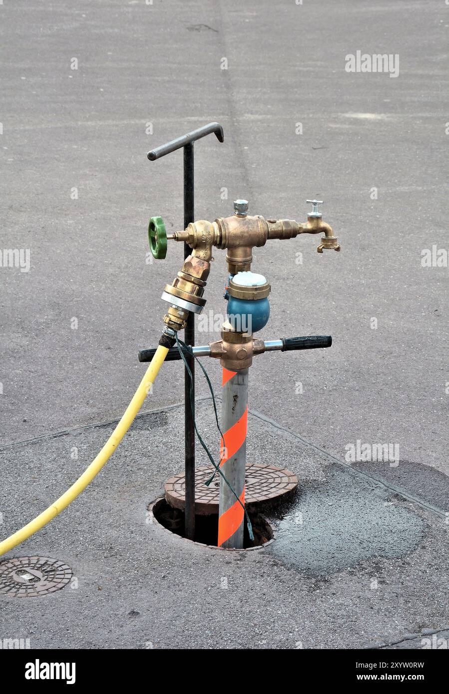 Drawing water from a hydrant Stock Photo - Alamy