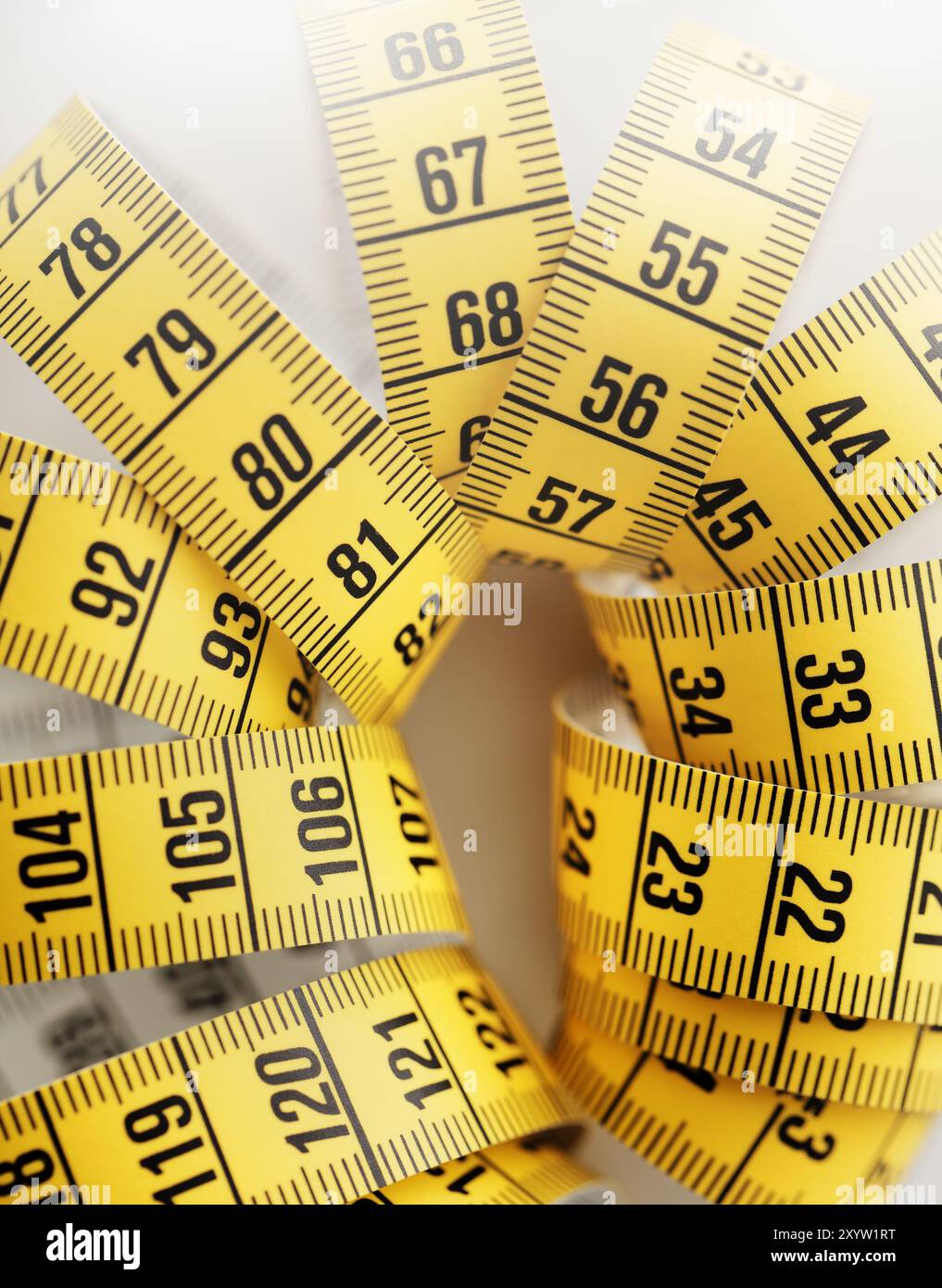 Yellow metric tape measure. Short depth-of-field Stock Photo - Alamy