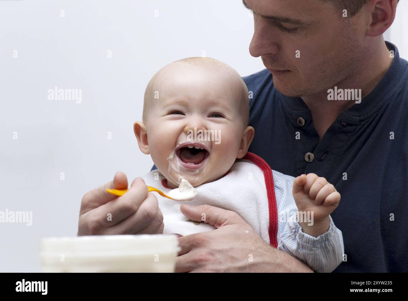 Father feeds baby hi-res stock photography and images - Alamy