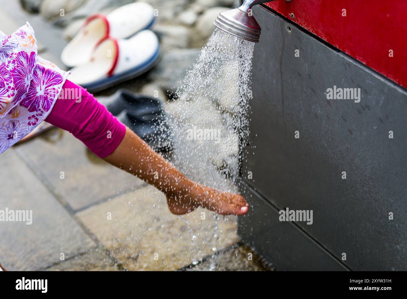 Children's feet under a shower, Buesum, Schleswig-Holstein, Germany ...