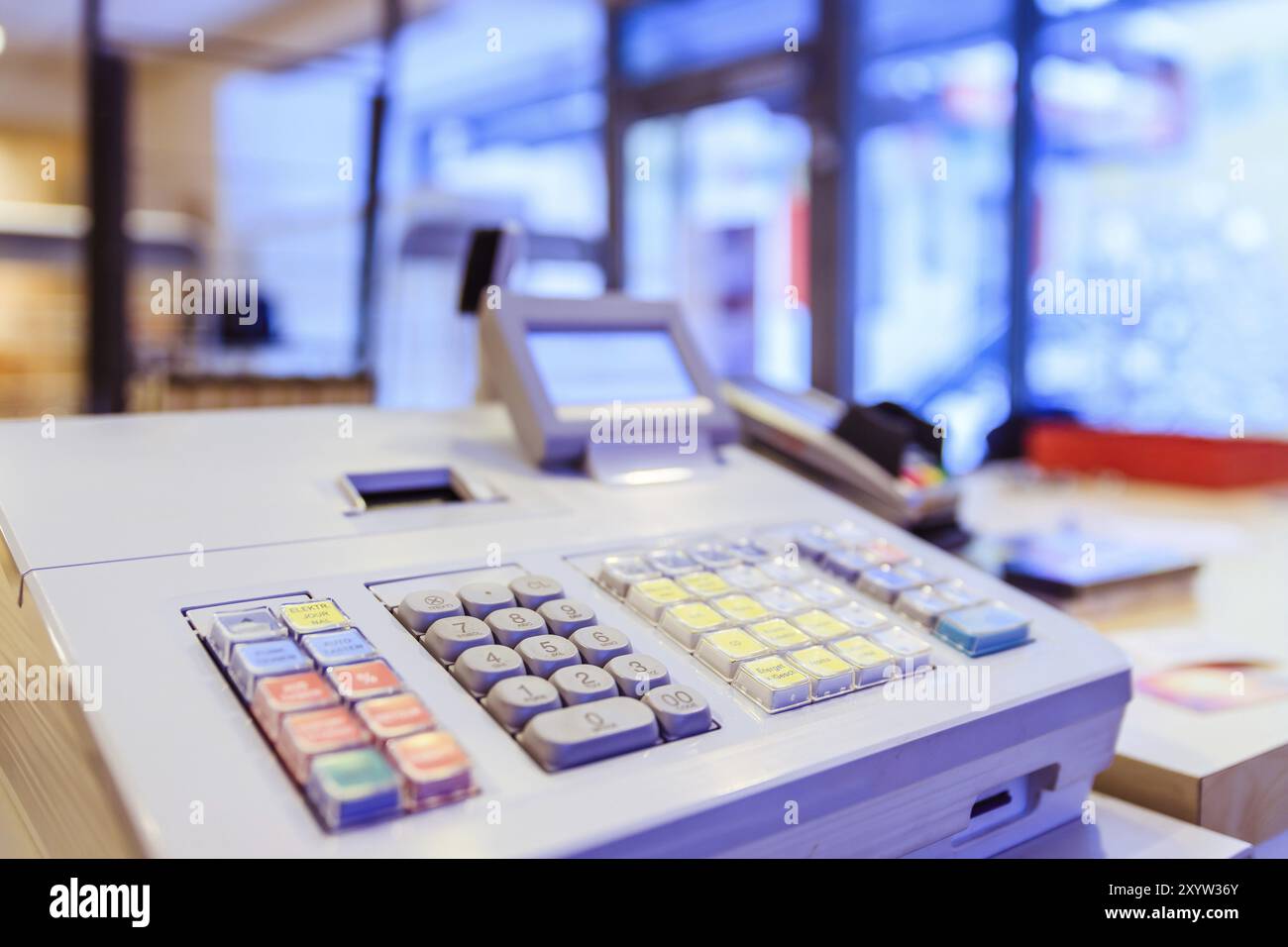Cash register in a shop: Customer is paying purchase Stock Photo - Alamy