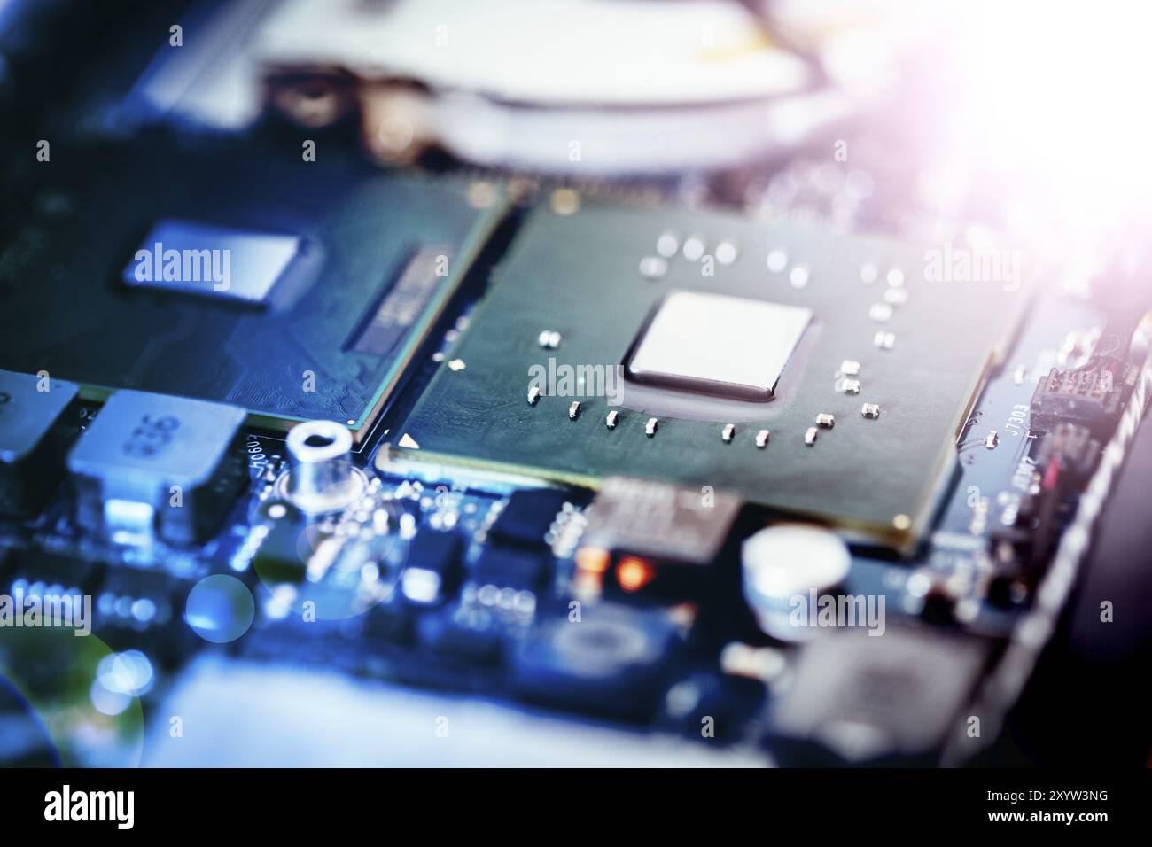 Computer chip on a circuit board, close up with light effect. Computer ...