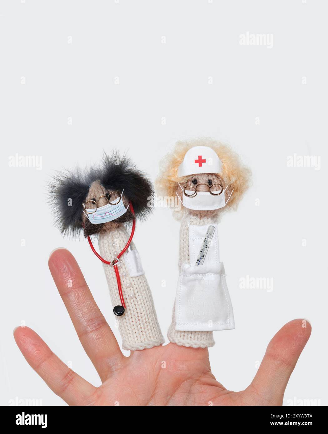 Finger puppets with doctor and nurse with mouth and nose protection ...