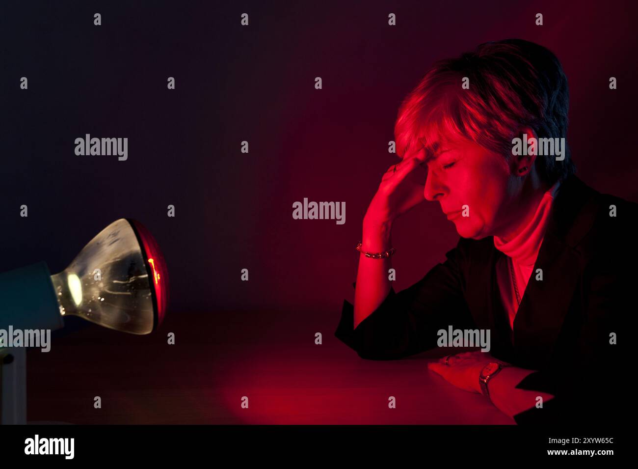 Female person with red light lamp Stock Photo - Alamy