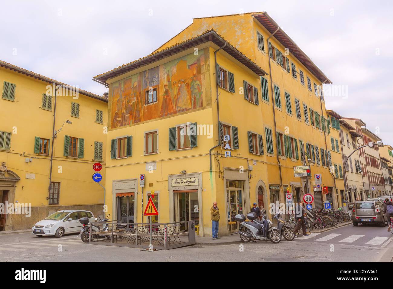 Florence, Italy, October 24, 2018: Old town street view with yellow ...