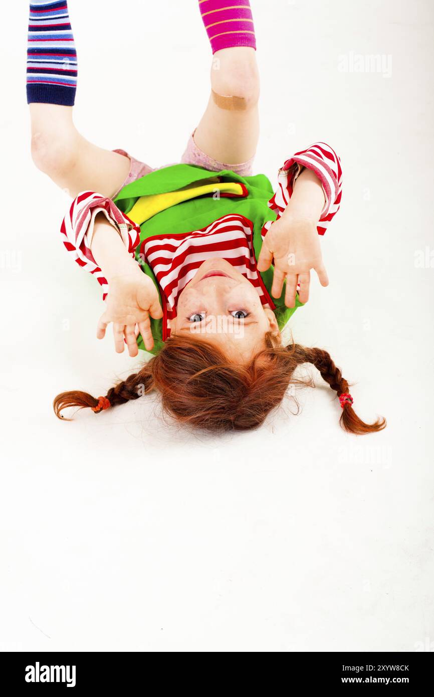 Little girl dressed as Pippi Longstocking with white background Stock ...