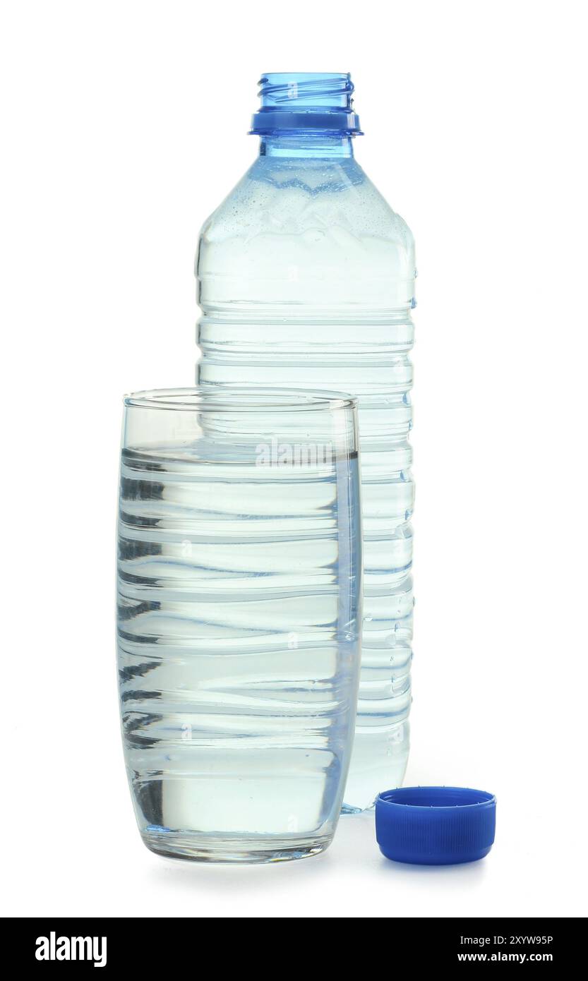 Polycarbonate plastic bottle of mineral water and glass of water ...