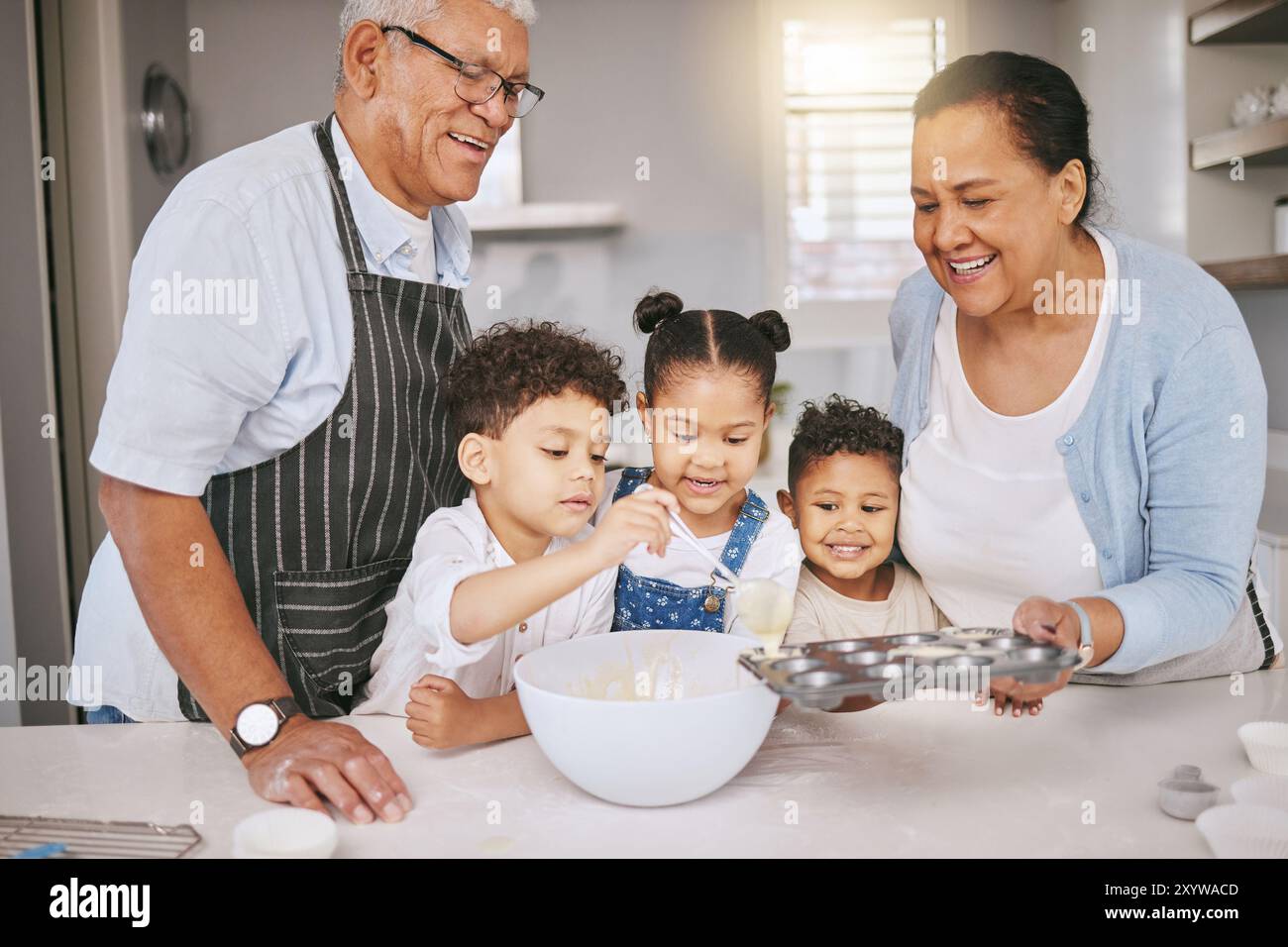 Grandchildren teaching grandma learning hi-res stock photography and ...